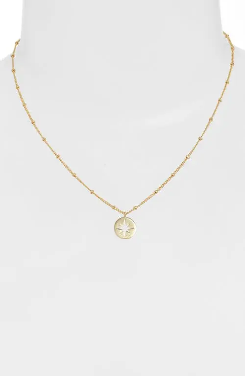 Estée Lauder Starburst Disc Pendant Necklace