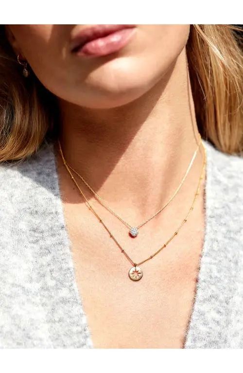 Estée Lauder Starburst Disc Pendant Necklace