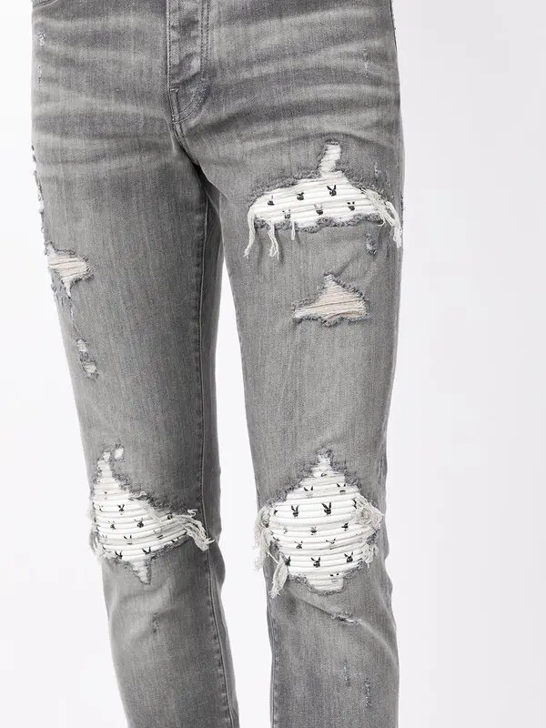 Amiri X Playboy Ripped-Effect Skinny Jeans - Grey | Editorialist