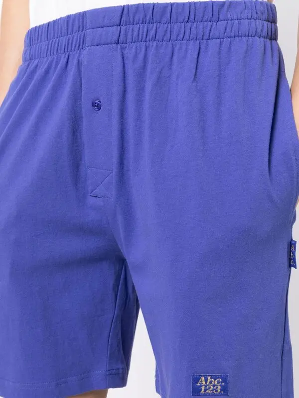 ADVISORY BOARD CRYSTALS Logo Print Lounge Shorts - Purple