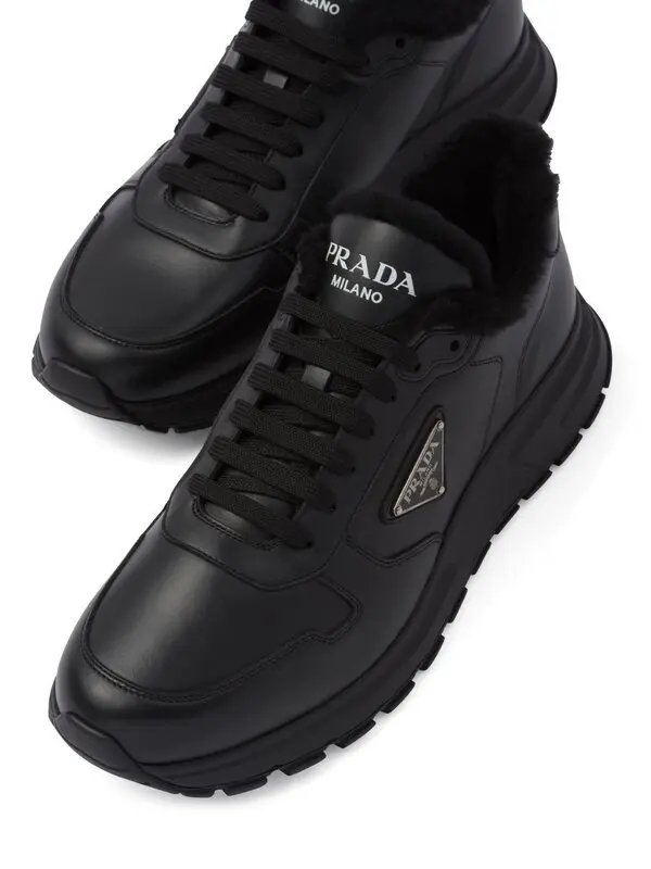 Prada Logo Leather Sneakers - Black | Editorialist