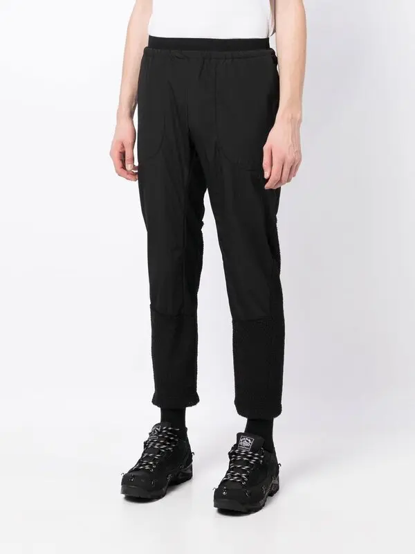 AND WANDER Fleece-panel Trousers