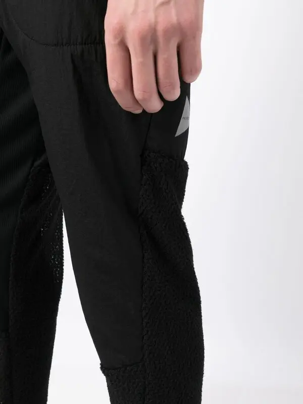 AND WANDER Fleece-panel Trousers