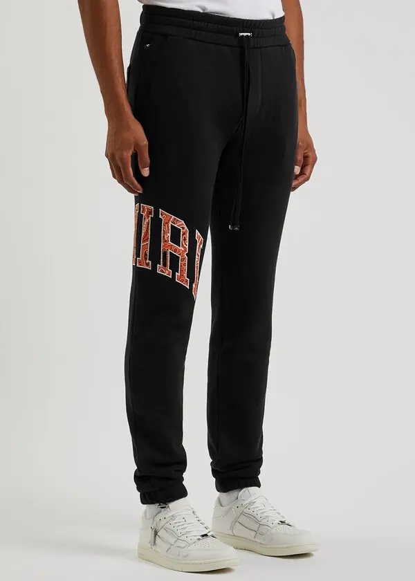 Amiri Logo-appliquéd Cotton Sweatpants