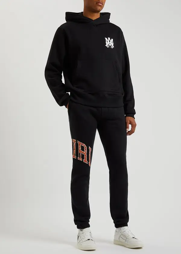 Amiri Logo-appliquéd Cotton Sweatpants