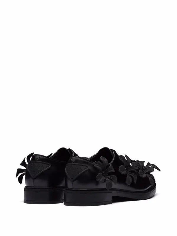 Prada Floral-Appliqué Leather Derby Shoes - Black | Editorialist
