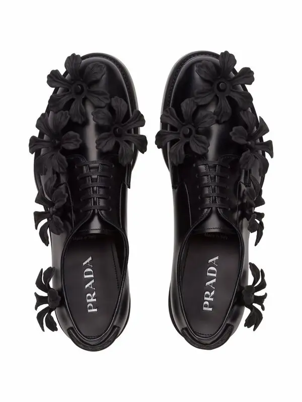 Prada Floral-Appliqué Leather Derby Shoes - Black | Editorialist