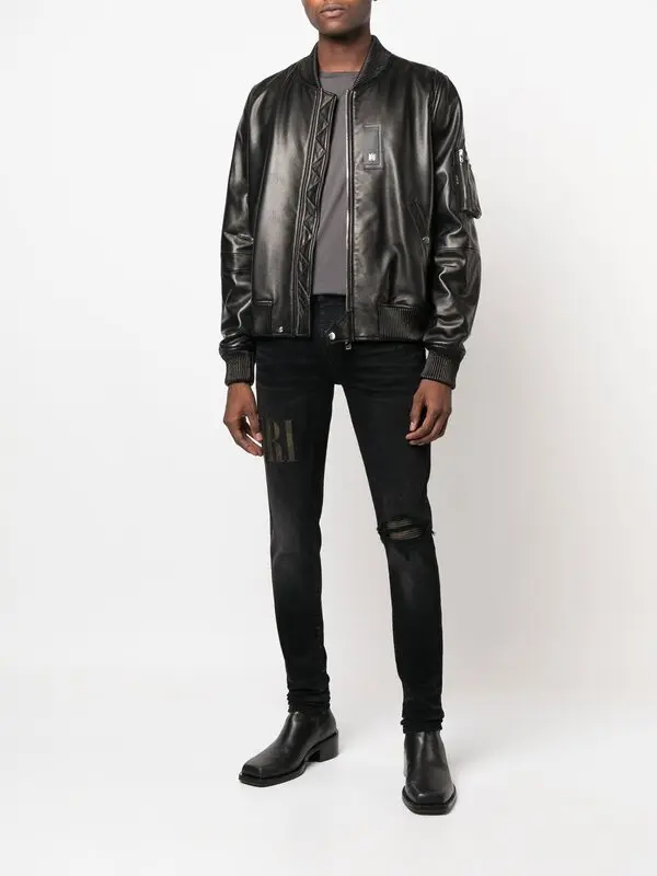 Amiri Logo-appliqué Distressed Jeans