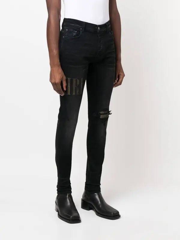 Amiri Logo-appliqué Distressed Jeans
