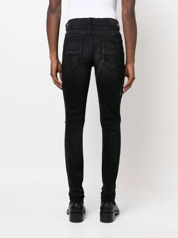 Amiri Logo-appliqué Distressed Jeans