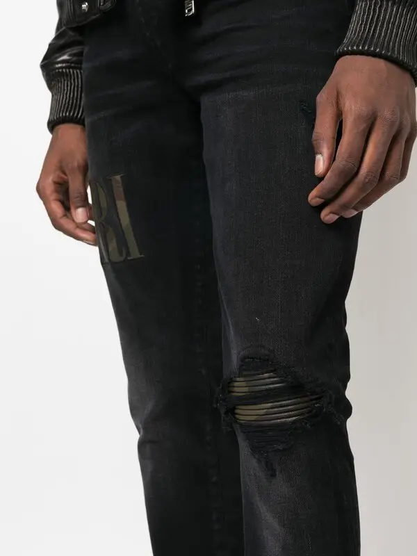 Amiri Logo-appliqué Distressed Jeans