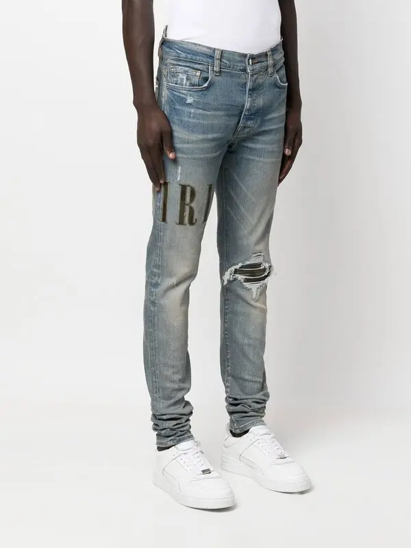 Amiri Logo-print Distressed Skinny Jeans - Blue