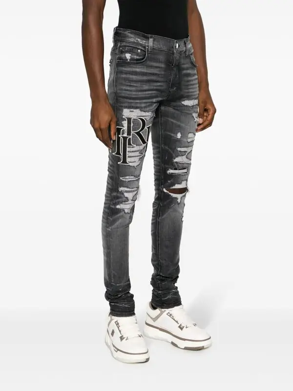 Amiri Staggered Skinny Jeans