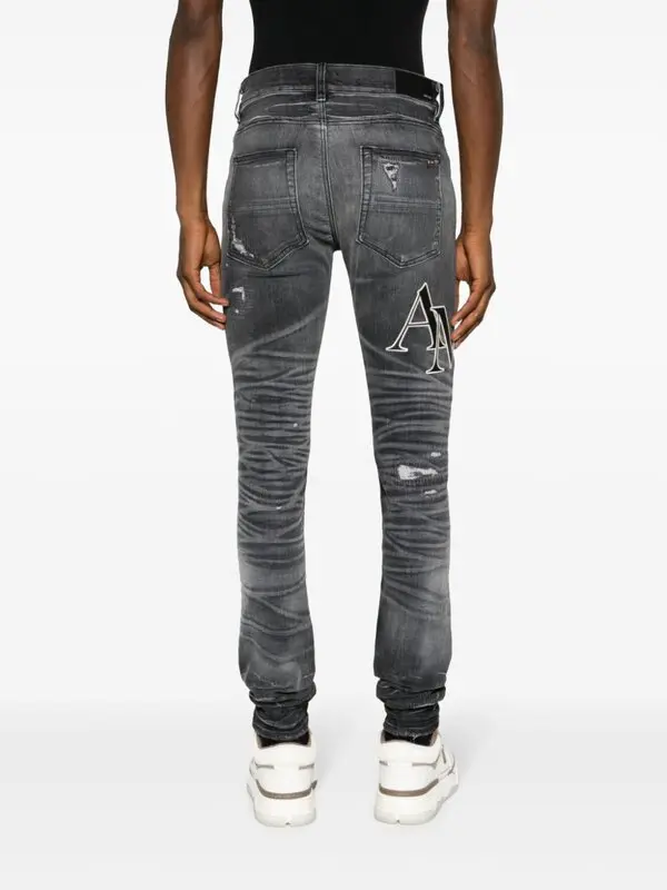 Amiri Staggered Skinny Jeans