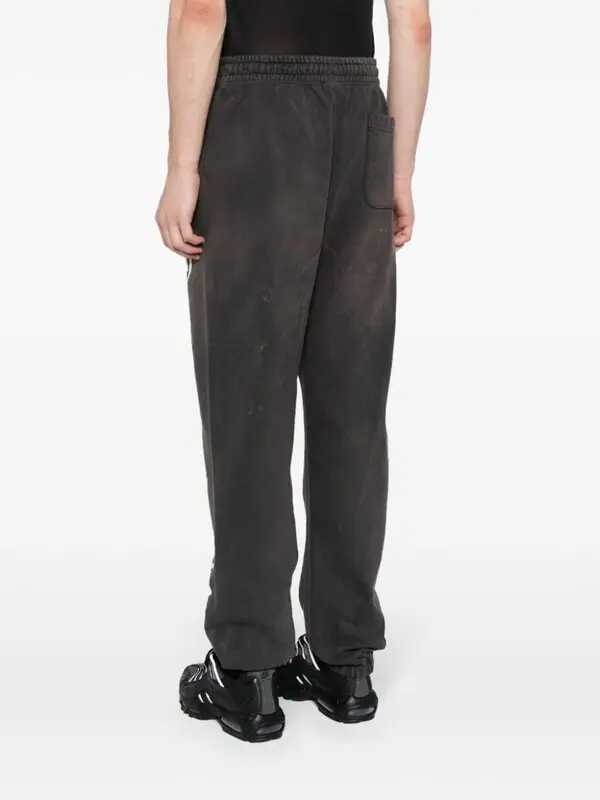 SAINT MXXXXXX Slogan-print Cotton Track Pants