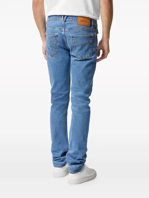 Versace Medusa Head-embellished Slim-fit Jeans - Blue