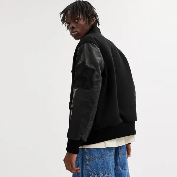 定価10万　LIL NAS X COACH ジャケット 袖レザー スタジャン Coach The Lil Nas X Drop Varsity Jacket - Black | Editorialist