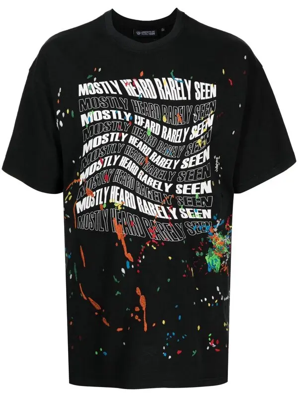MOSTLY HEARD RARELY SEEN Warped-logo Paint-splatter T-shirt - Black