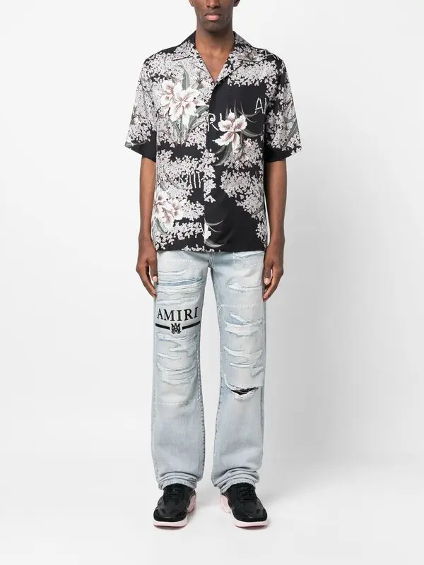 Amiri Logo-embroidered Ripped Jeans