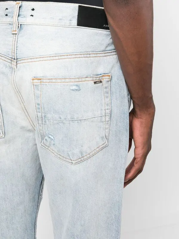 Amiri Logo-embroidered Ripped Jeans