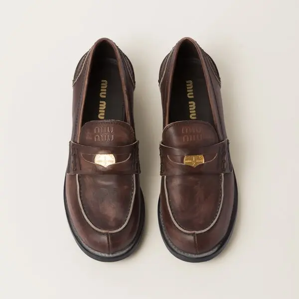 Miu Miu Vintage-Effect Leather Penny Loafers - Ebony | Editorialist