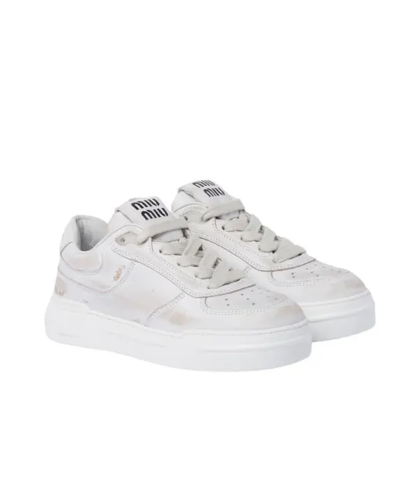 Miu Miu Bleached Leather Sneakers - White | Editorialist