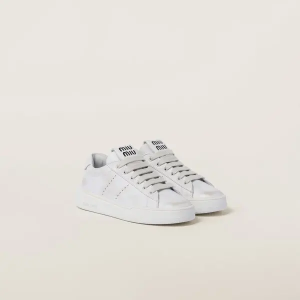Miu Miu Bleached Leather Sneakers - White | Editorialist