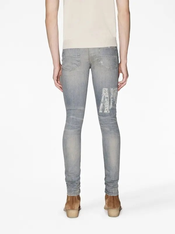 Amiri Distressed Logo Skinny Jeans