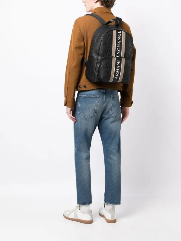 armani exchange nappa leather backpack – BexyClothing The design includes a fully lined interior and a prominent zippered front pocket for organized storage Armani Exchange Debossed-Logo Pocket Backpack