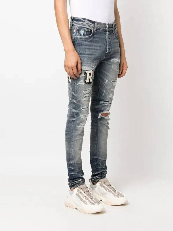 Amiri Varsity Ripped Skinny Jeans