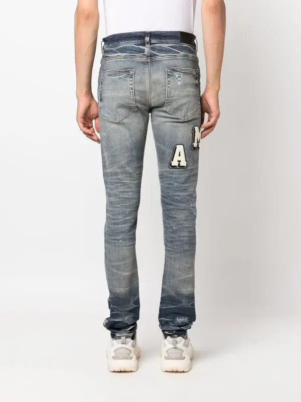Amiri Varsity Ripped Skinny Jeans