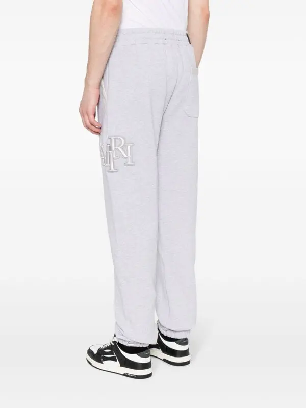 Amiri Staggered Logo-embroidered Track Pants
