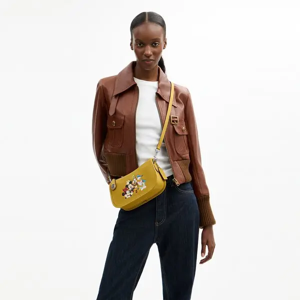 COACH Disney X Swinger Bag In Regenerative Leather With Mickey Mouse And Friends