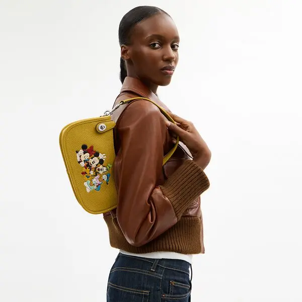 COACH Disney X Swinger Bag In Regenerative Leather With Mickey Mouse And Friends