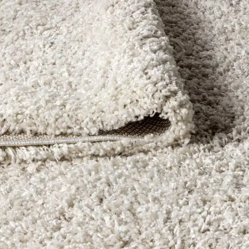 JONATHAN Y Mercer Shag Plush Tassel Area Rug - Cream