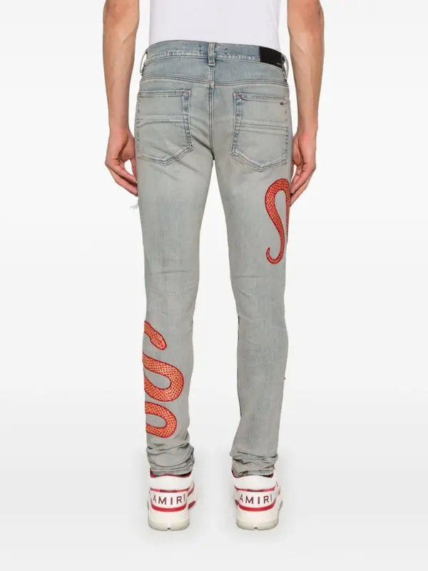 Amiri Snake Detailing Jeans In Blue - 70% Off | Editorialist
