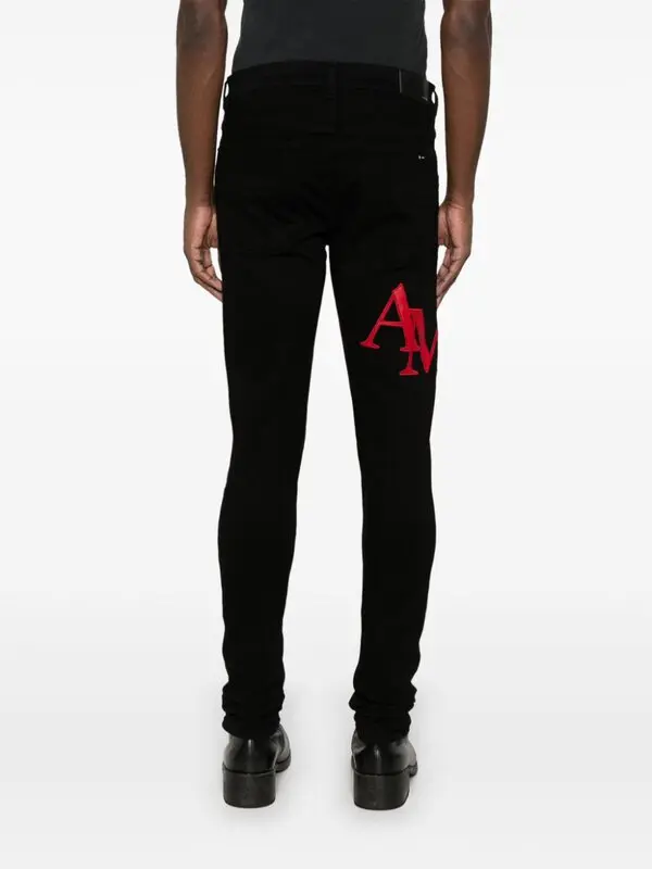 Amiri Staggered-logo Jeans