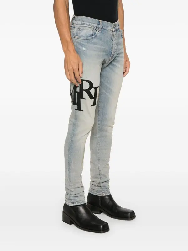 Amiri Staggered Logo Skinny Jeans - Blue