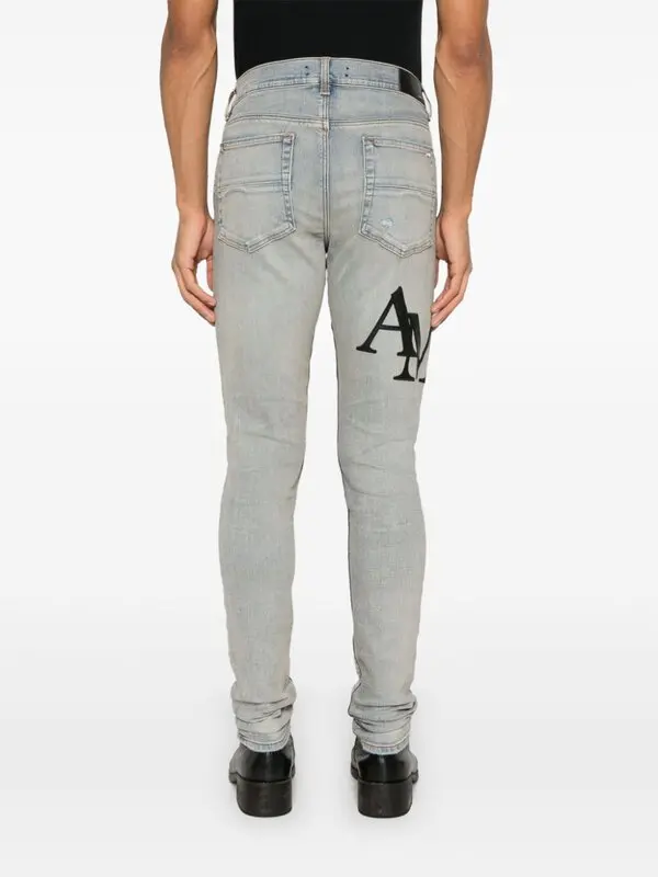 Amiri Staggered Logo Skinny Jeans - Blue