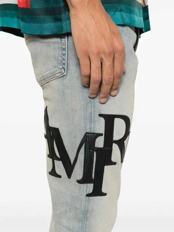 Amiri Staggered Logo Skinny Jeans - Blue