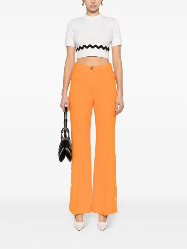 Patou Button-hem Flared Wool Trousers