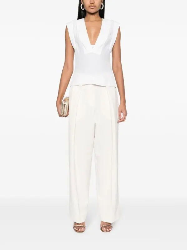 GENNY Logo-embellished Sleeveless Blouse