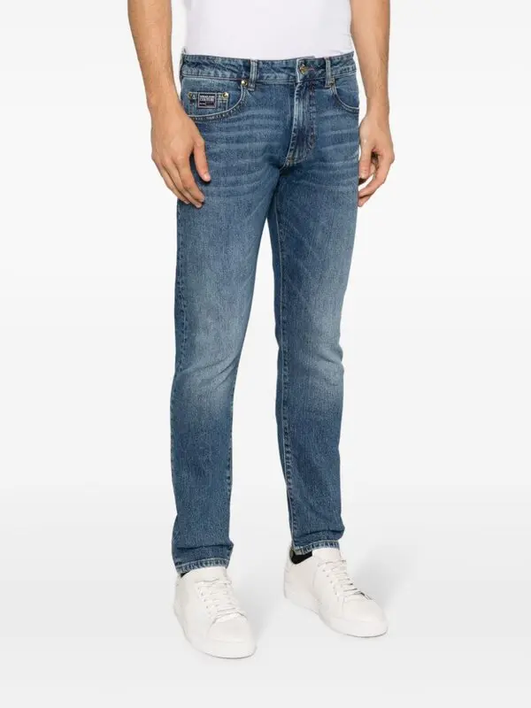 Versace Logo-appliqué Slim-cut Jeans