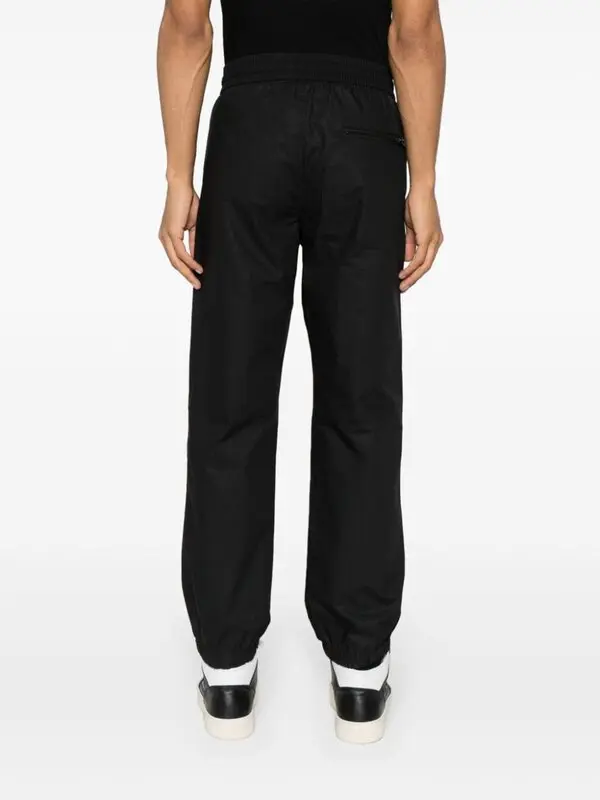 Versace Tapered-leg Trousers With Logo Strap