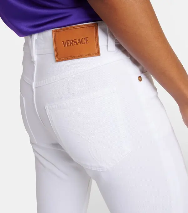 Versace Embellished Low-rise Flared Jeans