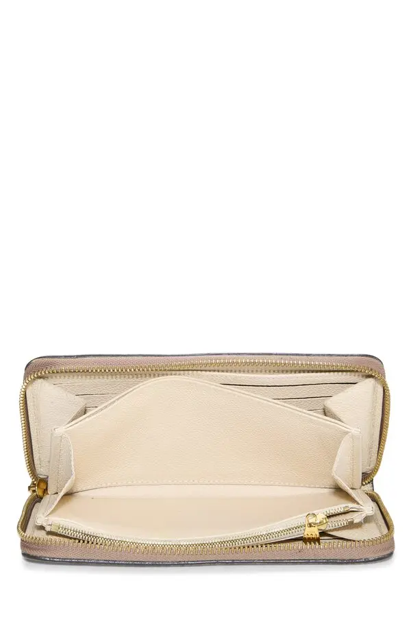 LOUIS VUITTON Giant Monogram Empreinte Zippy Continental - Cream