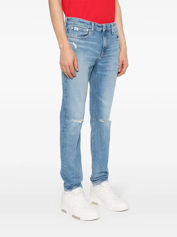 Calvin Klein Distressed Tapered-leg Jeans