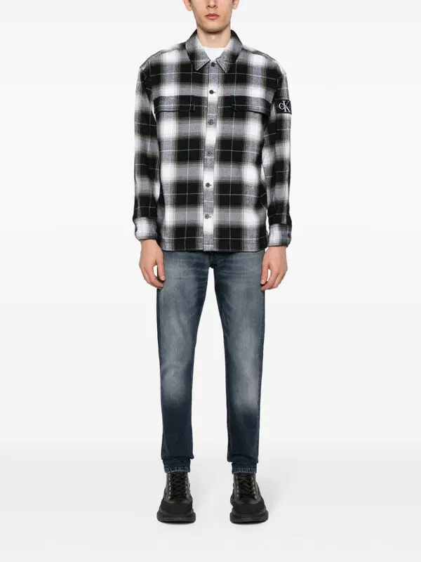 Calvin Klein Mid-rise Tapered-leg Jeans