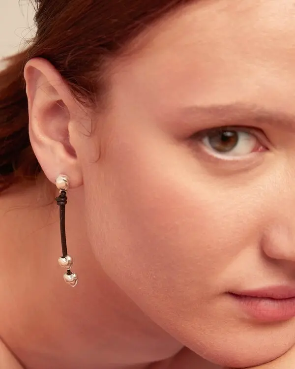 UNODE50 Leather Drop Earrings With Two Small Hearts