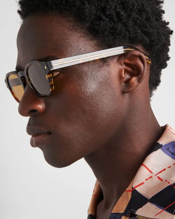 Prada Sunglasses With Metal Plaque